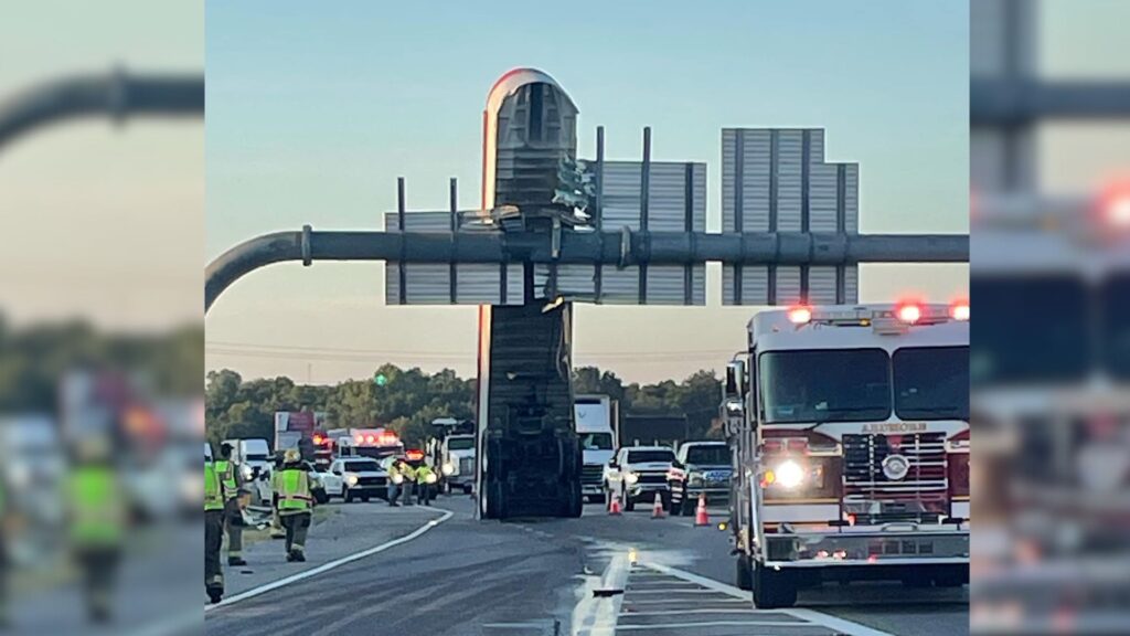 Inattentive Trucker Gets His Trailer Hung Up On A Highway Sign ...
